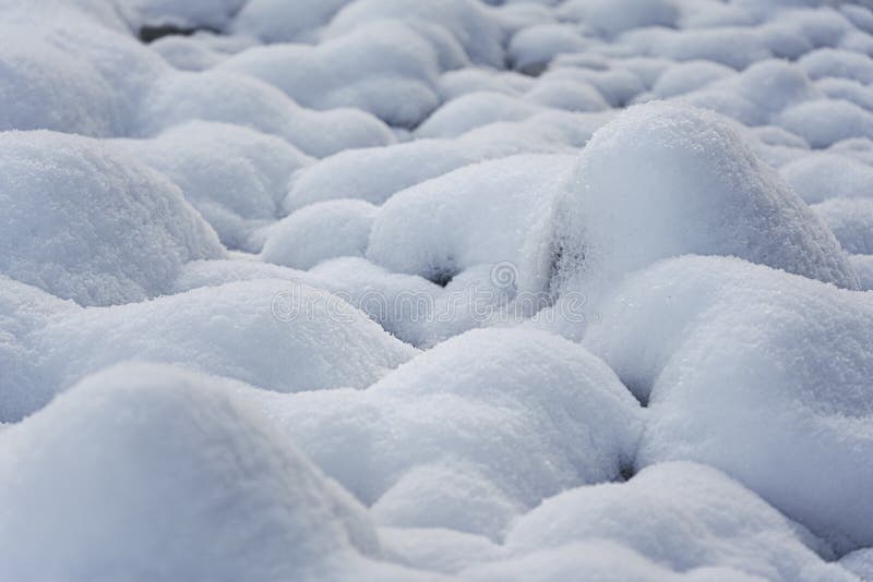 Round Rocks Near River Covered with Layer of Snow Stock Photo - Image ...