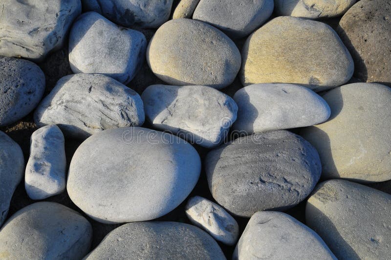 Round Rocks Smoothed by the Water Stock Photo - Image of coast, stones ...