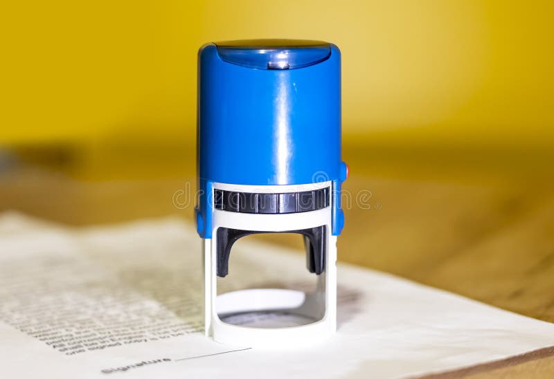 Round Rubber Stamp on Document on Wooden Table Stock Photo - Image of ...