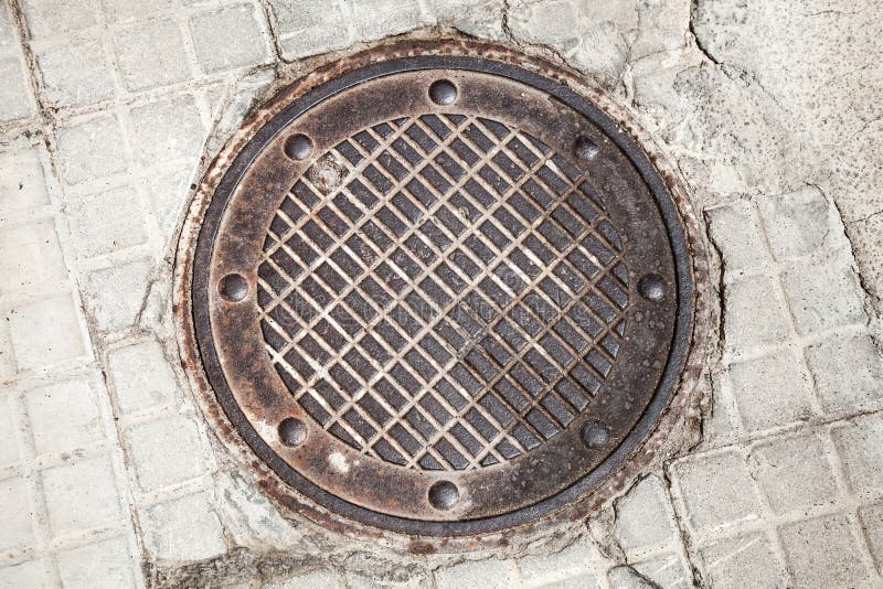 Round Rusted Hatch in Urban Pavement Stock Image - Image of industrial ...