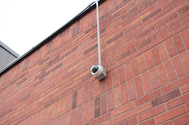 Round Security Cctv Camera Mounted To Brick Wall. P Stock Photo - Image ...