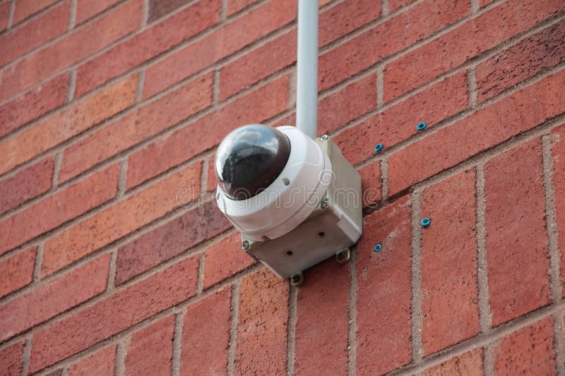 Round Security Cctv Camera Mounted To Brick Wall, Close Up. P Stock ...