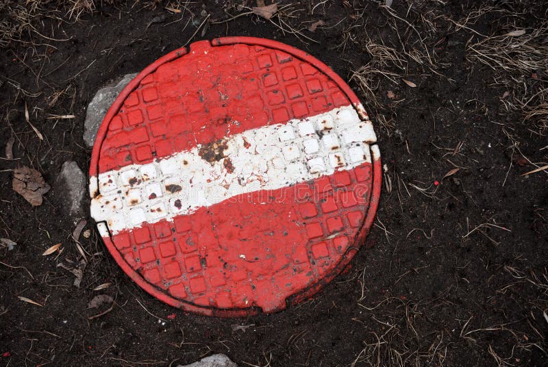 Round Sewer Manhole with Red Stop Sign Stock Image - Image of flood ...