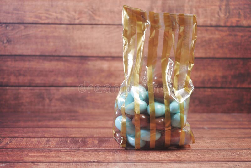 Round Shape Chocolate Candy in a Plastic Packet on Table Stock Image ...
