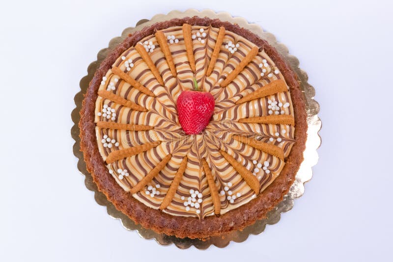 Round-shaped Cake Topped with Biscuits and a Strawberry Isolated on a ...