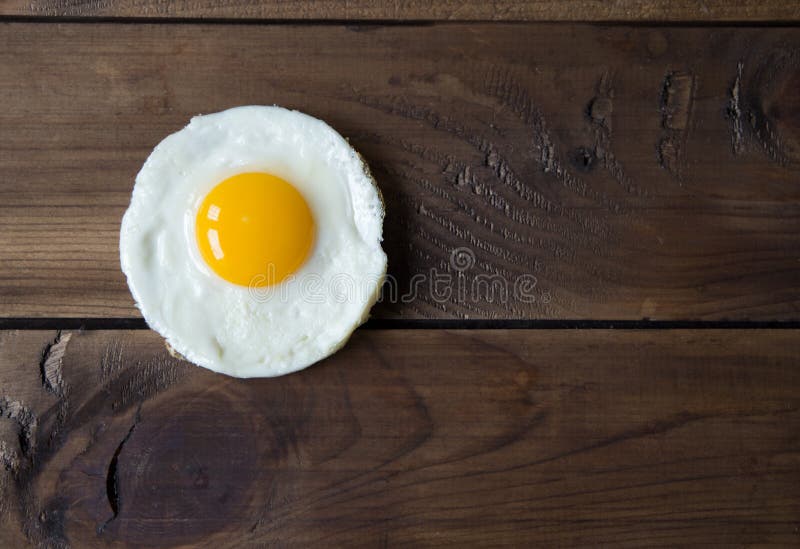 Round Shaped Fried Egg for Healthy Breakfast on Dark Wooden Backgrond ...