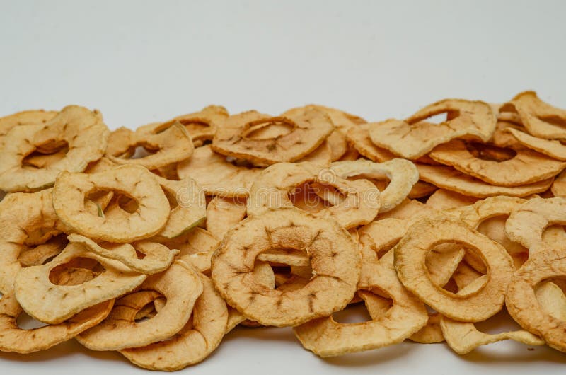 Round Slices of Dried Apples on a White Background. Apple Chips Stock ...