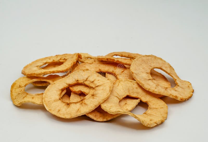 Round Slices of Dried Apples on a White Background. Apple Chips Stock ...