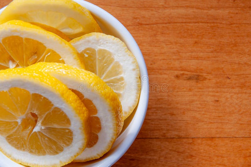 Slices of Lemons in a Round White Dish, Left Margin. Stock Photo ...