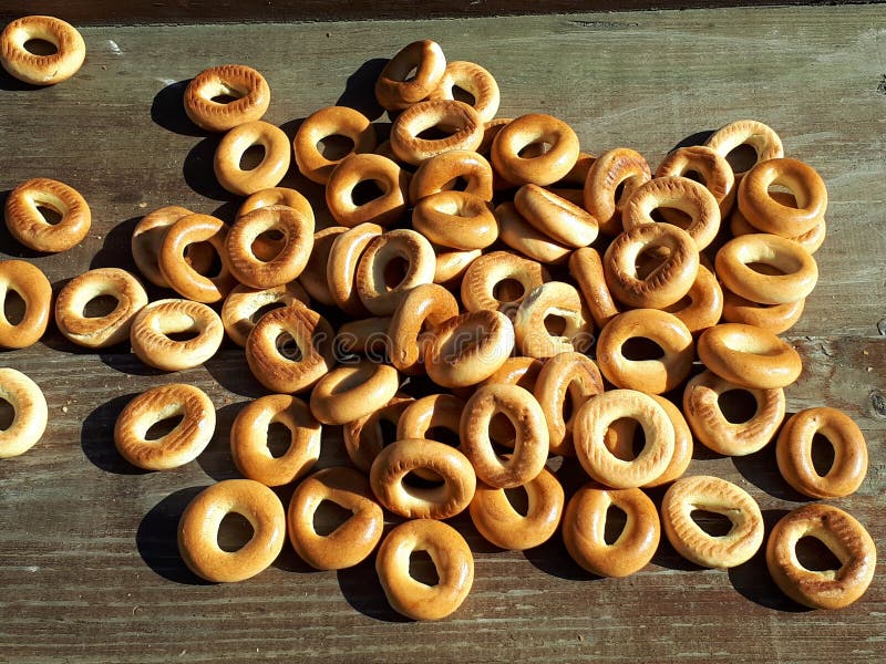 Round Small Crispy Bagels that are Lying on a Wooden Table Stock Photo ...