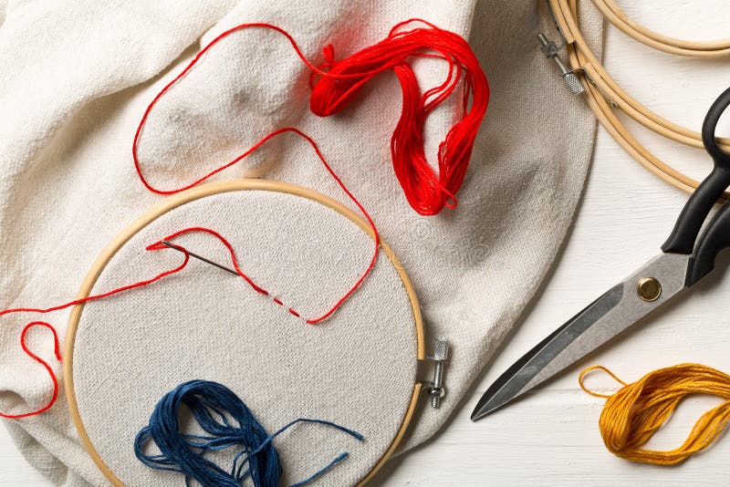 Round Stitching or Embroidery Frame with Red Stitching and Sewing Tools ...
