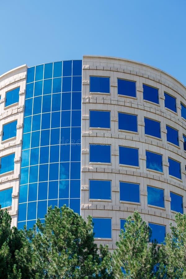 Round Stone Building with Blue Windows Stock Photo - Image of tall ...
