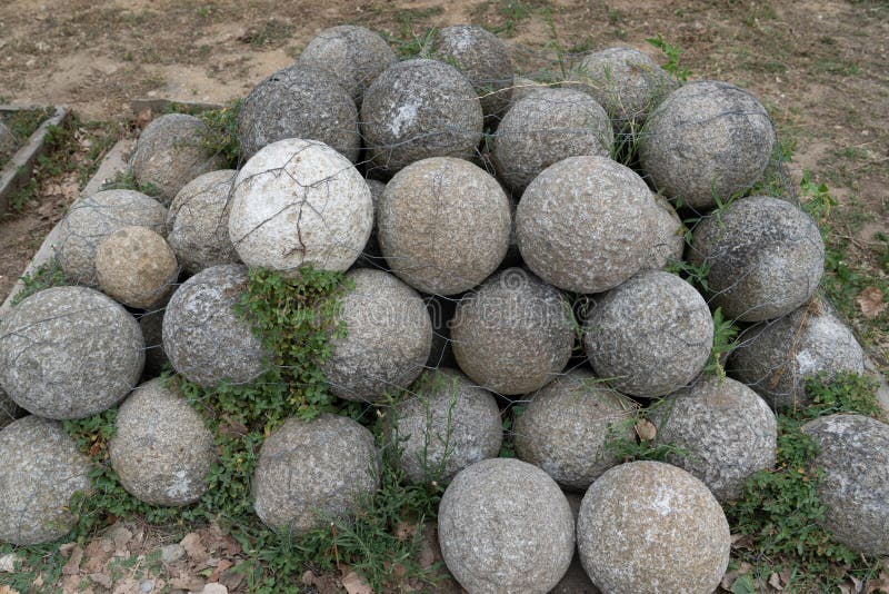 Round Stone Cores for an Ancient Catapult Stacked in a Pyramid Stock ...