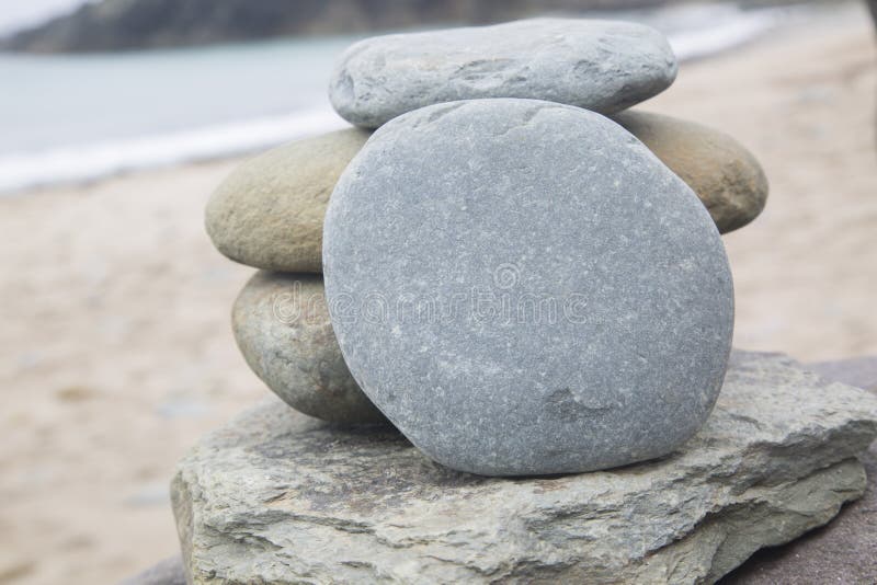 Round Stones on Beach stock photo. Image of circle, pile - 83438940