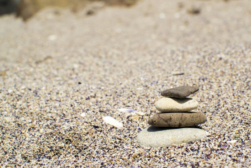 Round stones on the sand stock photo. Image of macro - 110740630