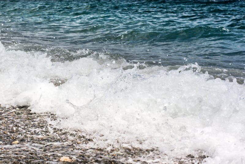 Round Stones at the Seashore with Sea Waves Stock Photo - Image of ...