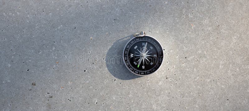 Round Stylish Compass on Concrete Background, Search Direction in ...