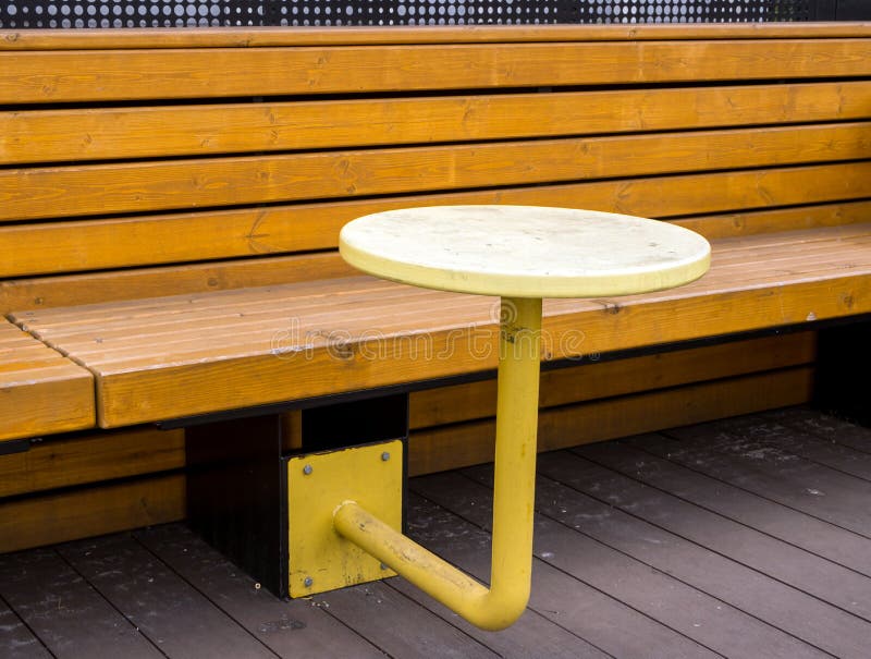Round Table Attached To a Bench on a Corner Support Stock Image - Image ...