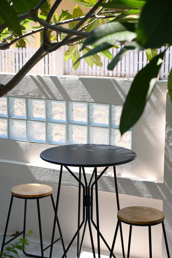 Round Table and Chairs in the Garden Stock Photo - Image of flower ...