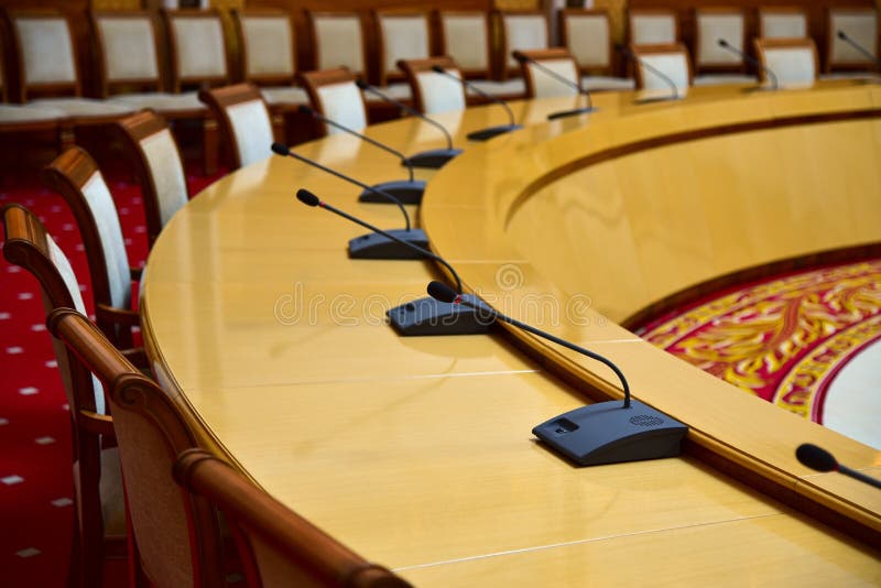 Round Table with Microphones for Diplomatic Negotiations in the Hall ...