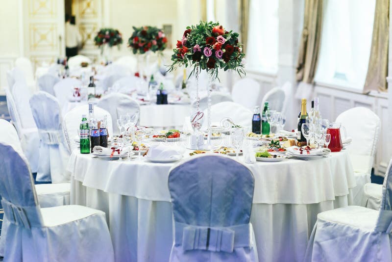 Round Tables Served with Cutlary and Food for a Festive Dinner Stock ...