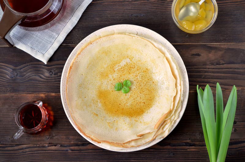 Round Thin Pancakes with Maple Syrup on the Table Stock Image - Image ...