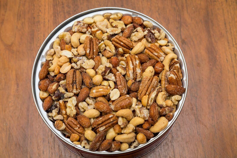 Round Tin of Mixed Nuts stock photo. Image of treat, close - 84730816