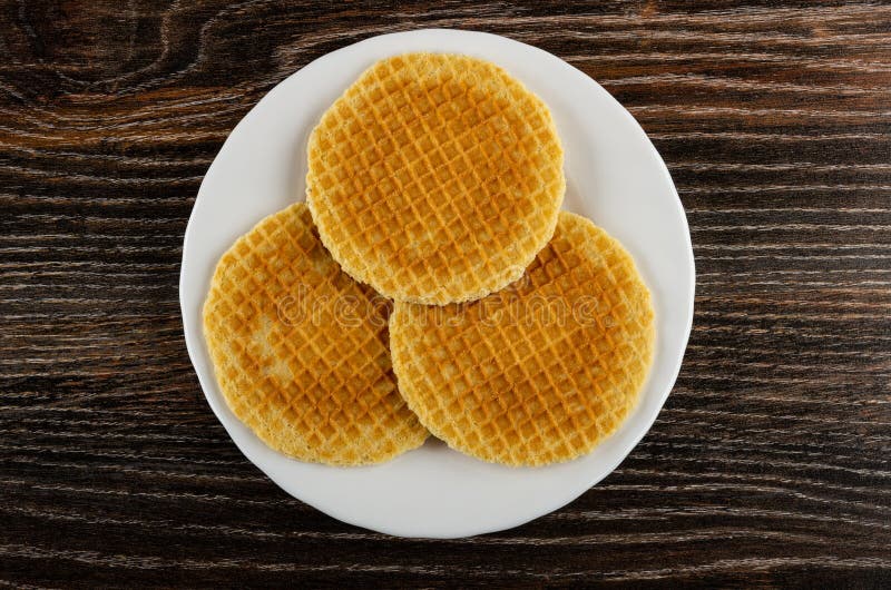 Round Wafers in Plate on Wooden Table. Top View Stock Image - Image of ...