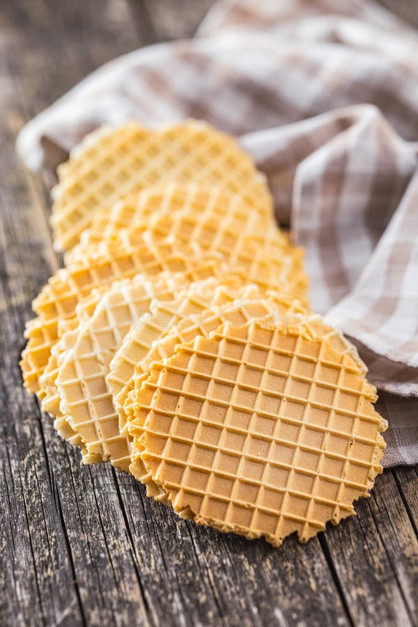 Round Waffle Biscuits on Wooden Table Stock Photo - Image of stack ...