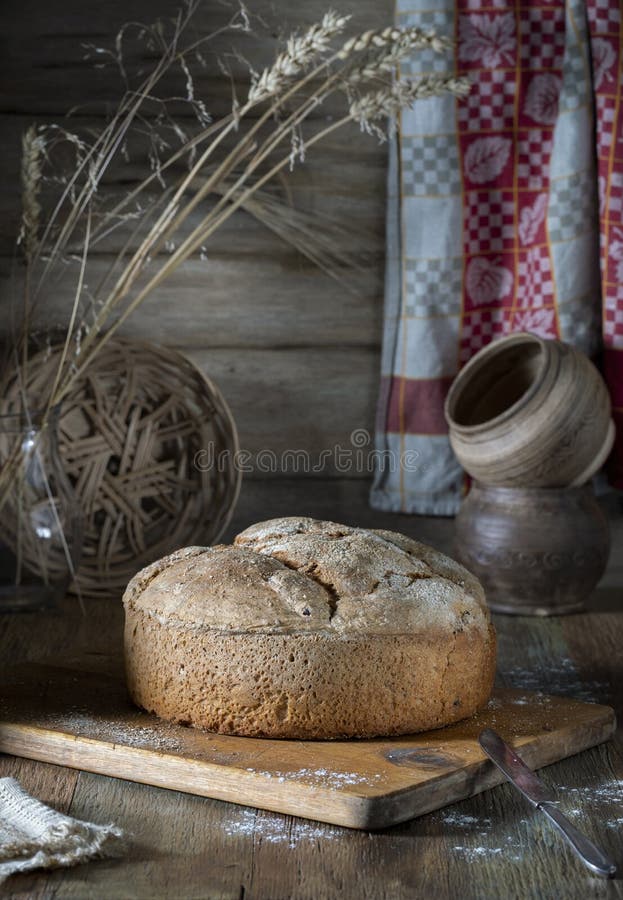Round Wheat Homemade Bread on a Rustic Table Stock Image - Image of ...