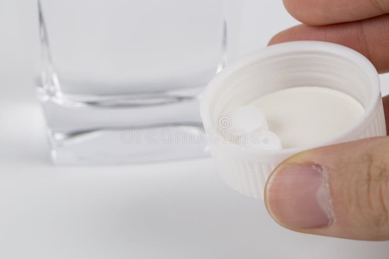 Round White Pills and Glass of Water Stock Photo - Image of water ...