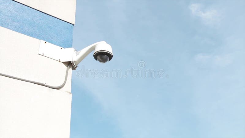 Round Wide Angle Security Camera Mounted on Corner of Building Wall in ...