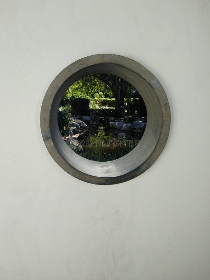 Round window Asia Garden stock image. Image of asia - 147491335