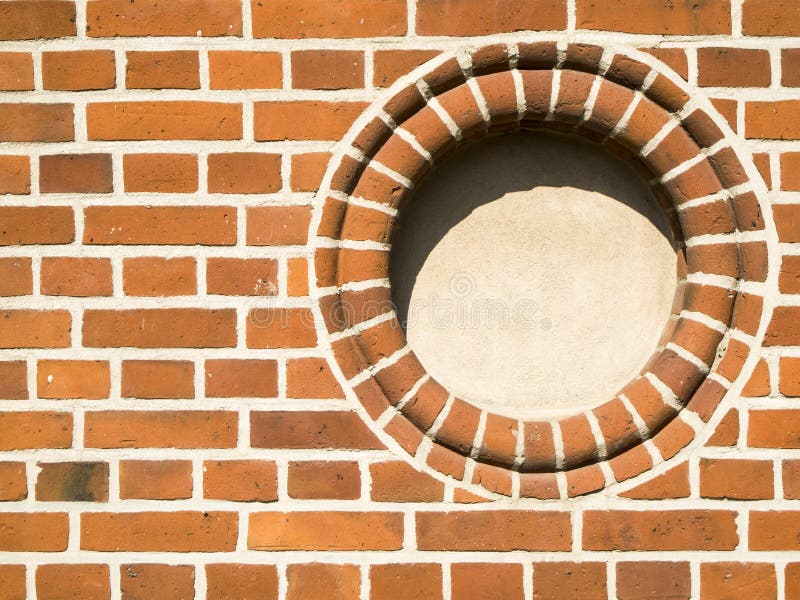 Round window in brick wall stock photo. Image of facade - 165611284