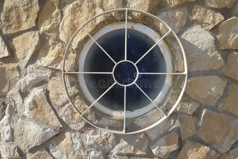 Round Window with a Circular Metal Grill Stock Photo - Image of design ...