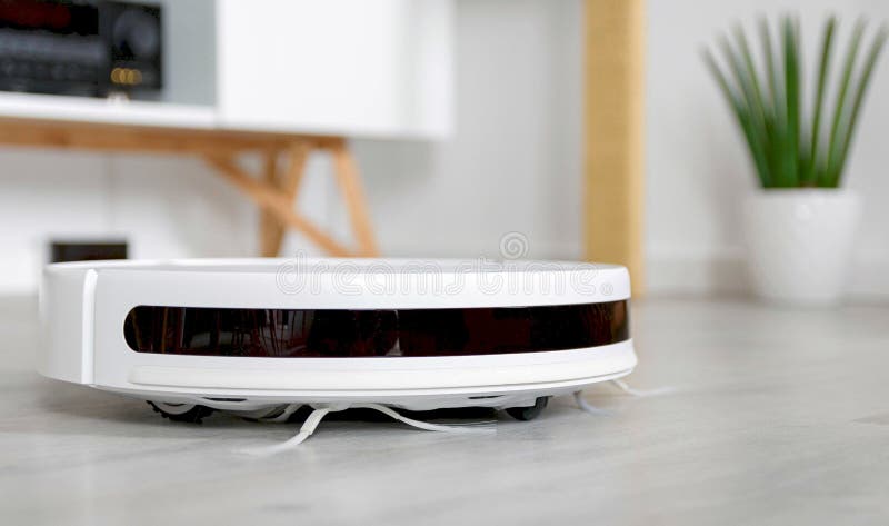 Round Wireless Vacuum Cleaner on the Floor Stock Image - Image of ...