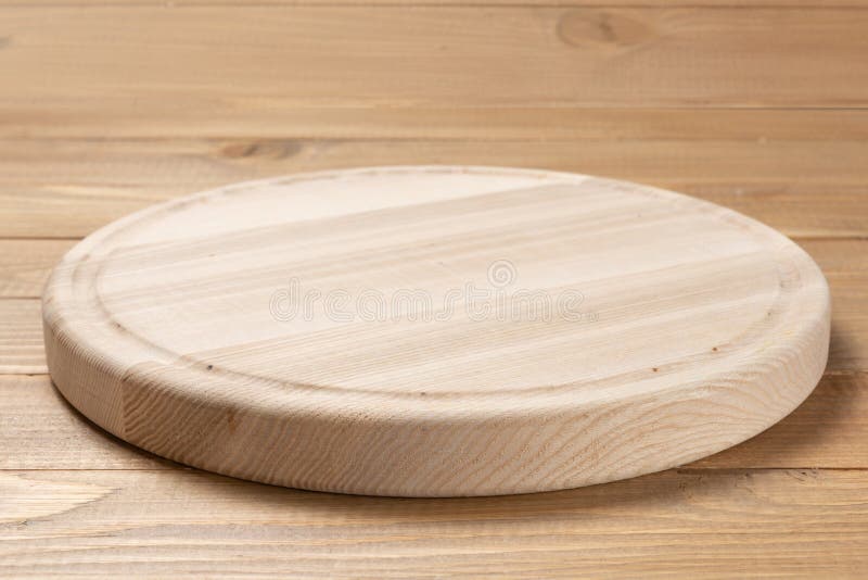 Round Wooden Cutting Board on a Wooden Table, Empty Thick Board, Rustic ...