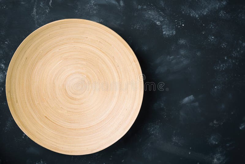 Round Wooden Plate Black Stone Table White Stains Stock Photos - Free ...