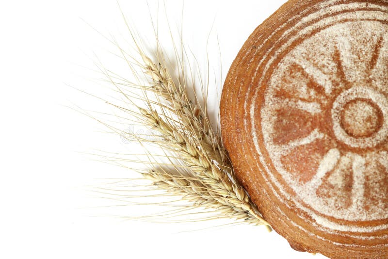 Round Yeast-free Rye Bread and Ears of Rye on a White Isolated ...