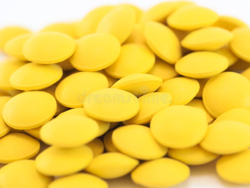 Round yellow pills stock photo. Image of yellow, vitamins - 15437462