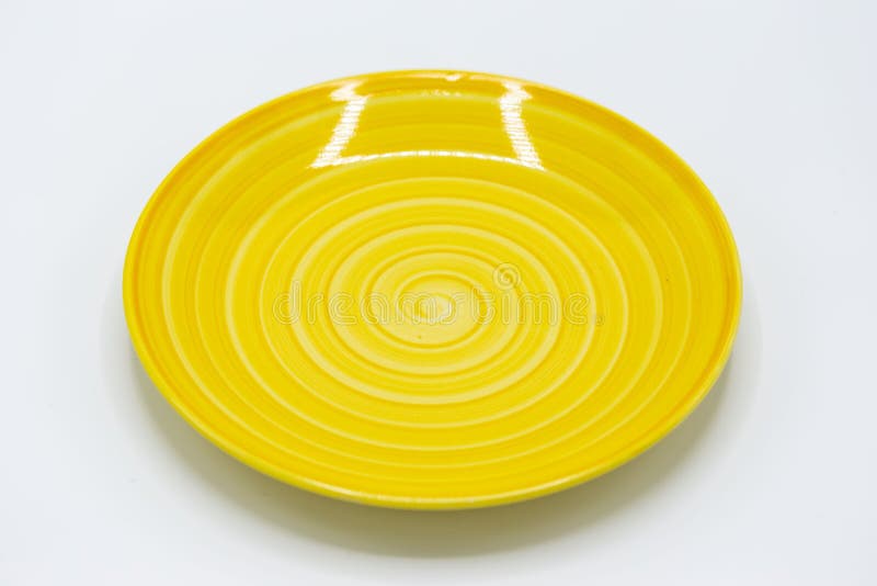 Round Yellow Plate with a Circular Swirl Pattern Stock Photo - Image of ...