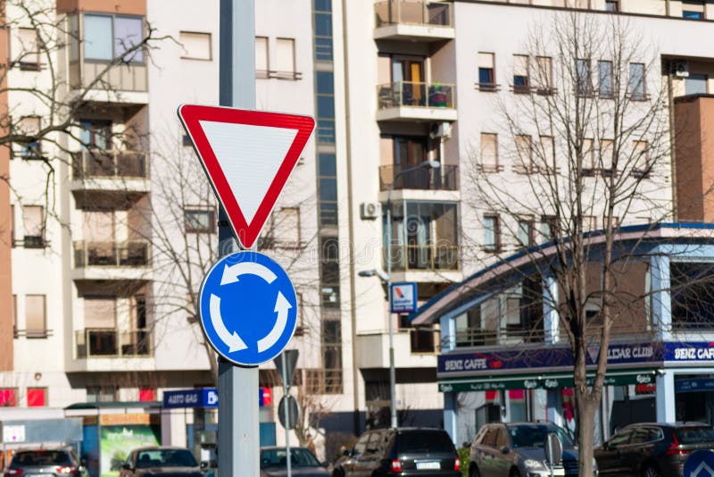 Roundabout and Give Way Signs Stock Image - Image of traffic, clear ...