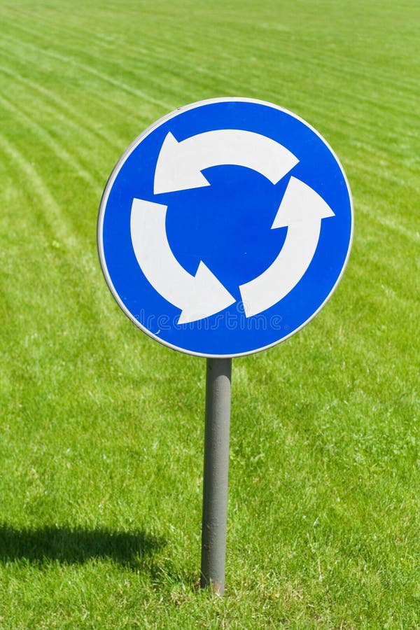 Roundabout road sign stock photo. Image of bright, lawny - 5417604