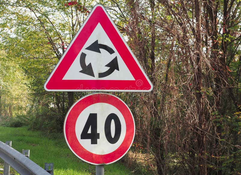 Roundabout and Speed Limit Sign Stock Photo - Image of roundabout ...