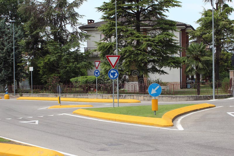 Roundabout with Yellow Curb and Green Grass in Summer Stock Image ...