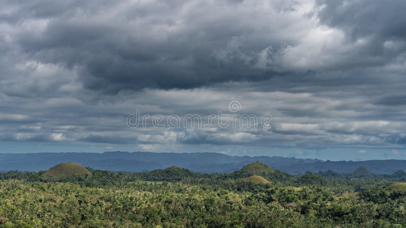 Rounded Hills Covered with Brownish Grass are Visible in the Valley ...
