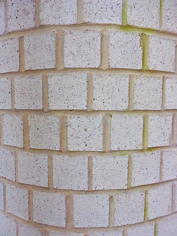 A Rounded Wall at the Edge of a Building Using Half Bricks Stock Image ...