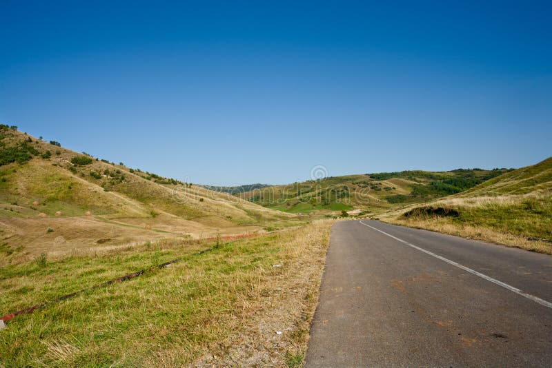 Route going through hills stock image. Image of field - 15917487