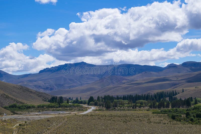 Asphalt Road between Mountains Stock Image - Image of trees, forest ...