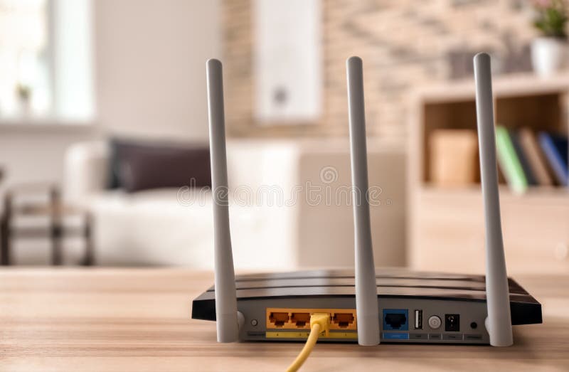 Router Moderno De Wi-Fi En La Tabla De Madera En Sitio Imagen de ...
